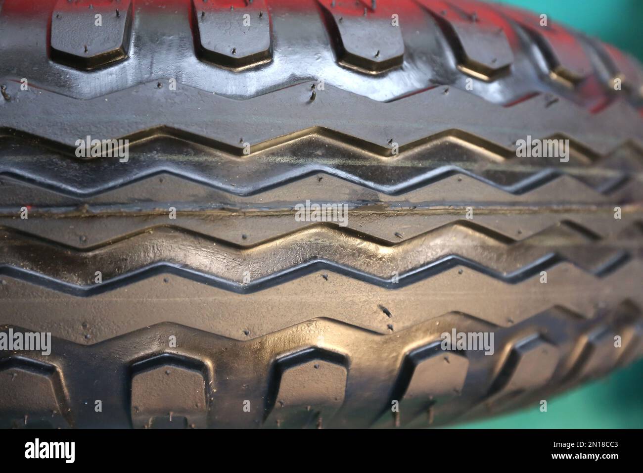 Details of tractor tire. Detail of large wheel. Heavy black wheel ...