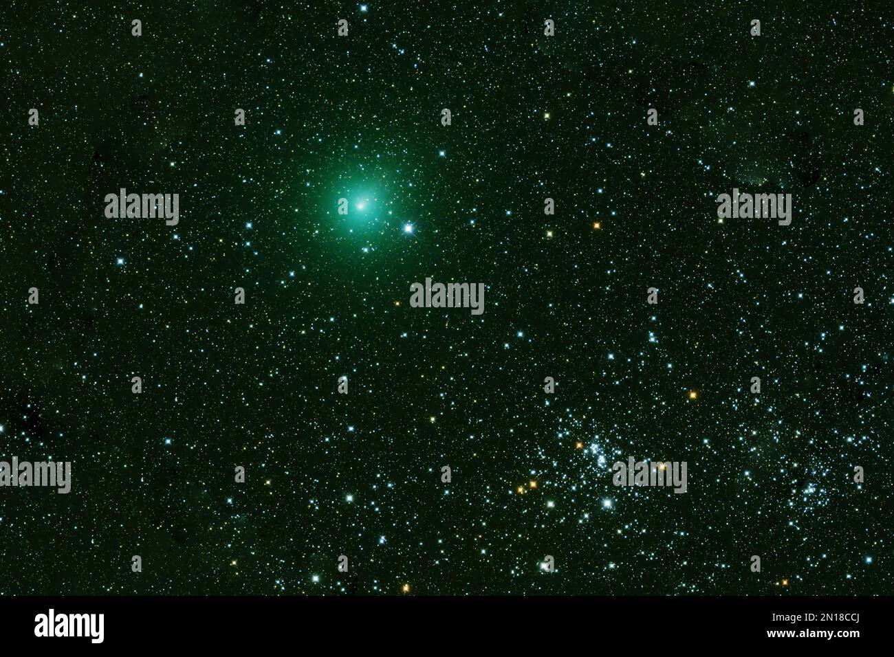 Green comet in dark space. Elements of this image furnished by NASA ...