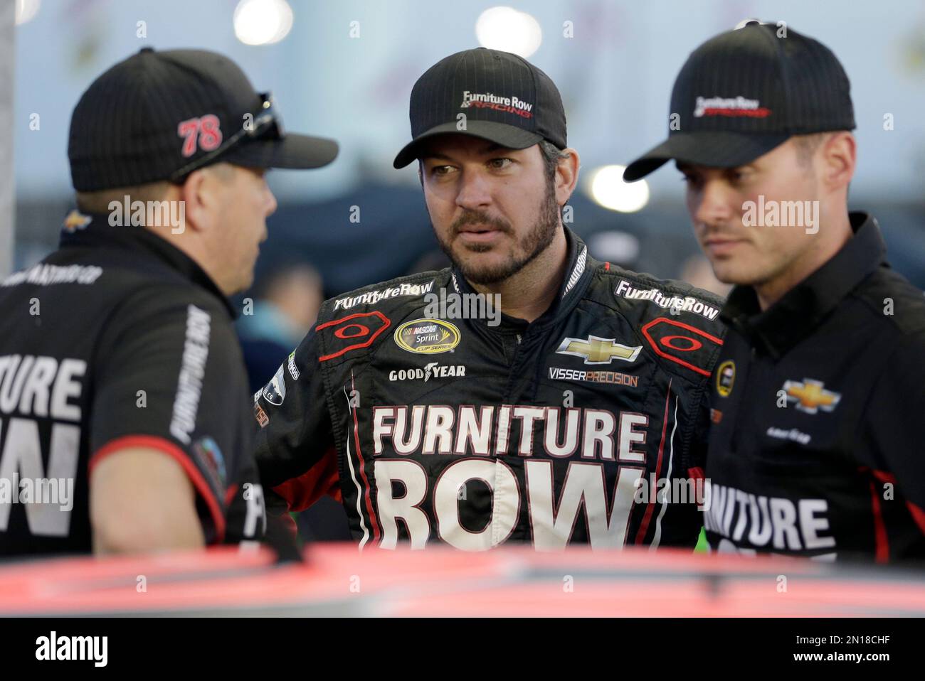 Martin Turex Jr., center, talks with crew members before qualifying for ...