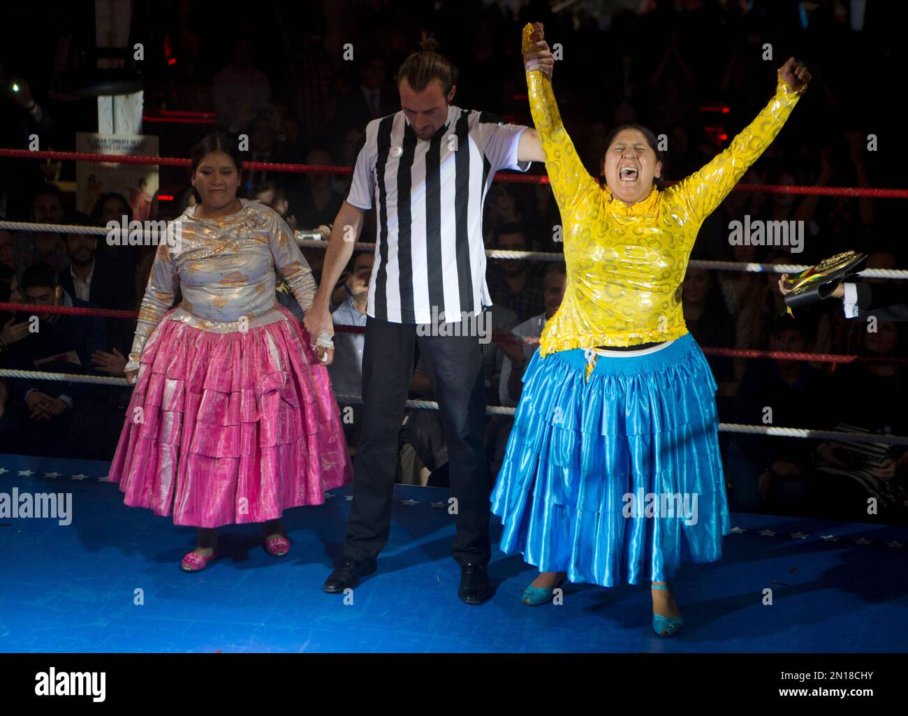 Yenny Mamani ‘Marta la Altena,’ right, is declared the winner after her ...
