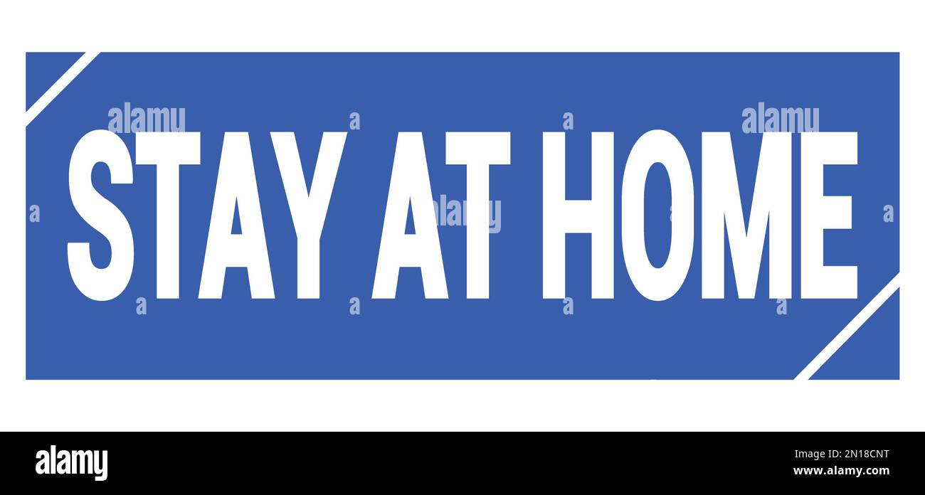 STAY AT HOME text written on blue grungy stamp sign Stock Photo - Alamy