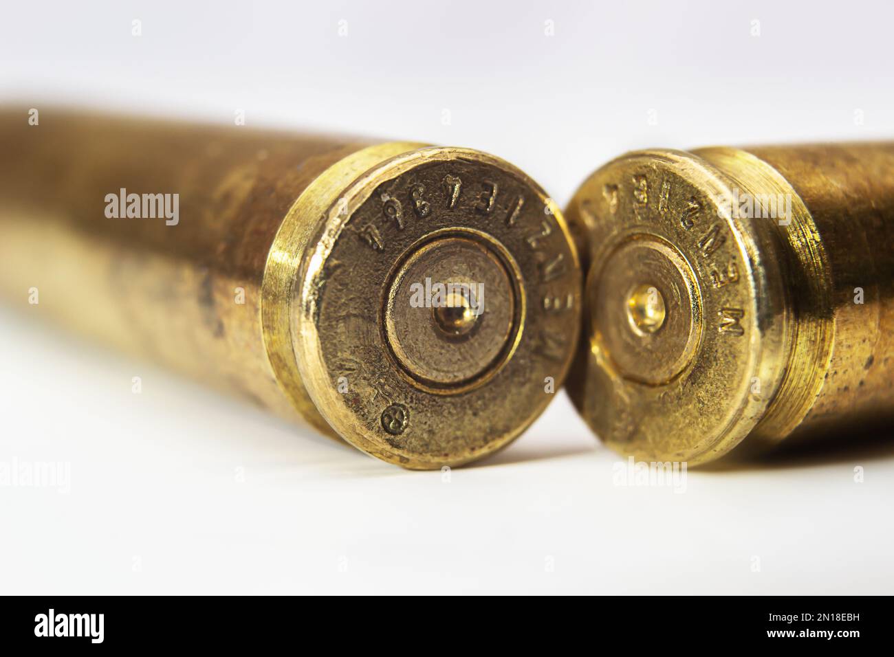 two machine gun cartridge cases on white background close up Stock ...