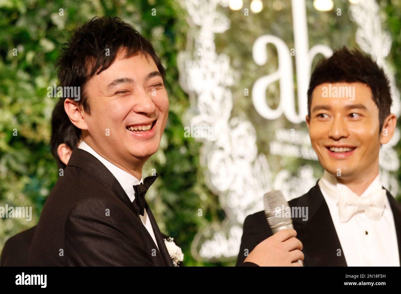 Chinese millionaire Wang Sicong, left, laughs during the wedding of ...