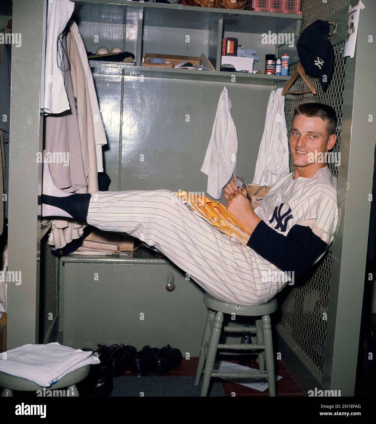 New York Yankees outfielder Roger Maris reads mail at his Yankee ...