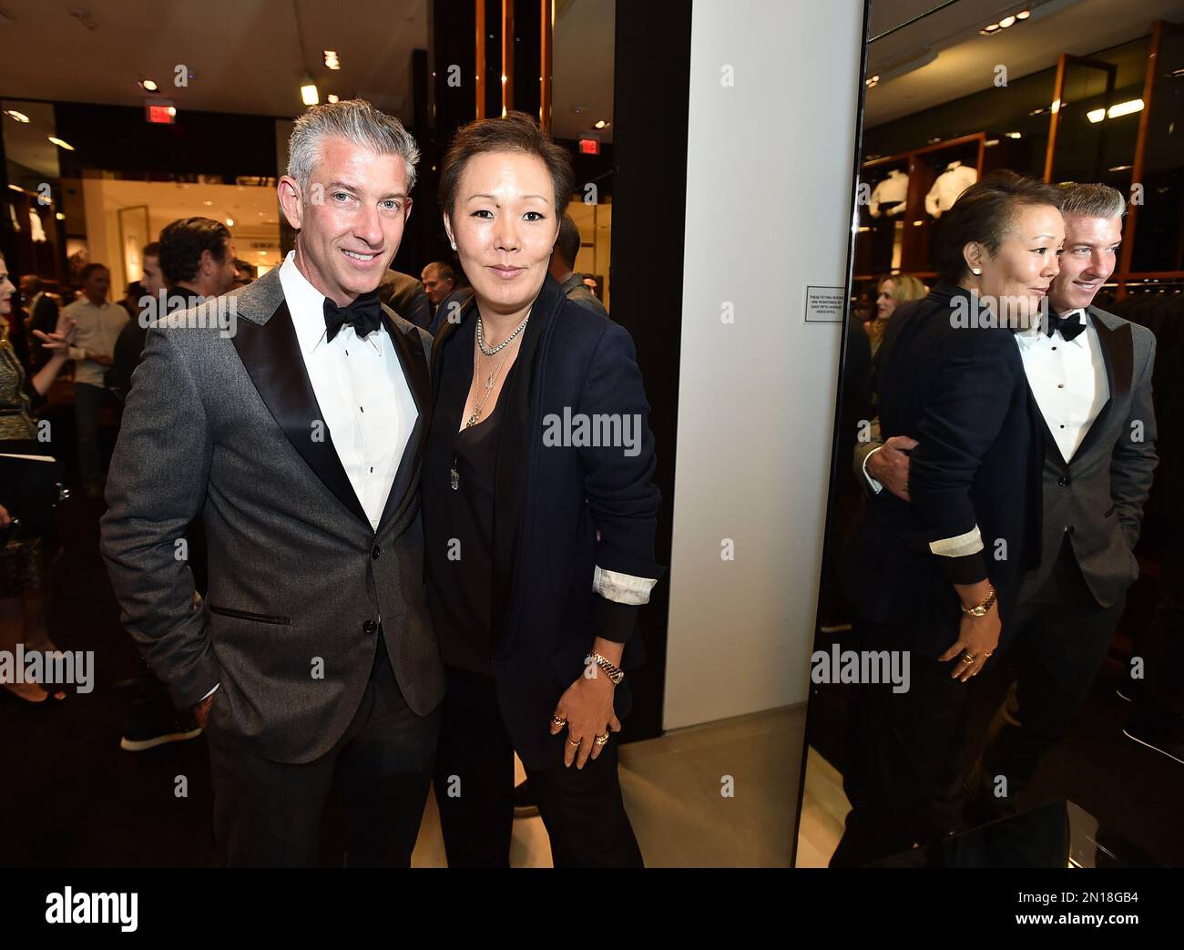 John McIlwee, left, and Jeanne Yang attend the Saks' Men's Formal Wear ...