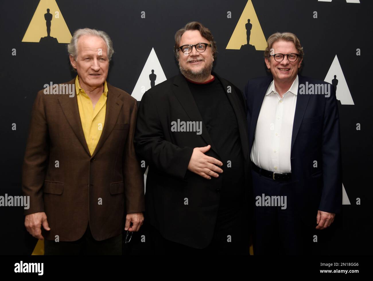 Filmmaker Guillermo Del Toro, center, poses with filmmaker Michael Mann ...