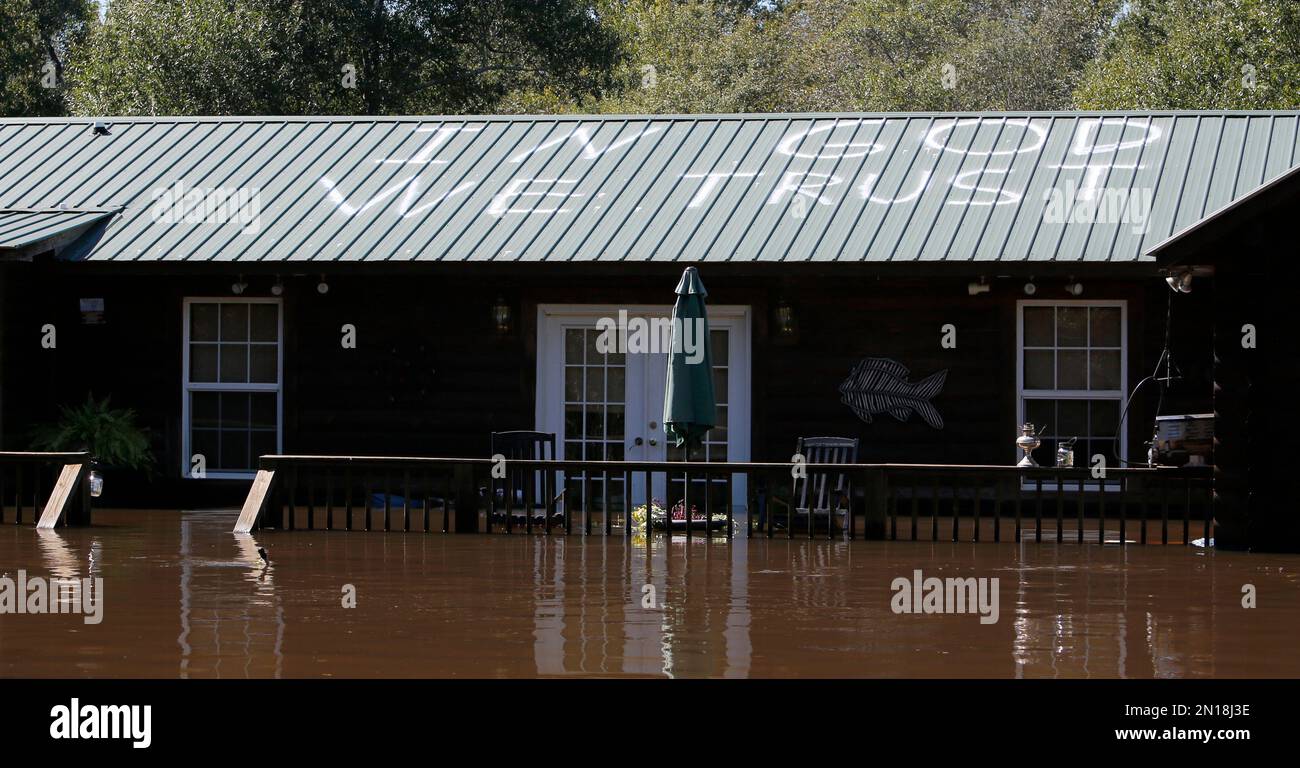 The home of Lisa and Jody Britton's is surrounded by floodwater in ...