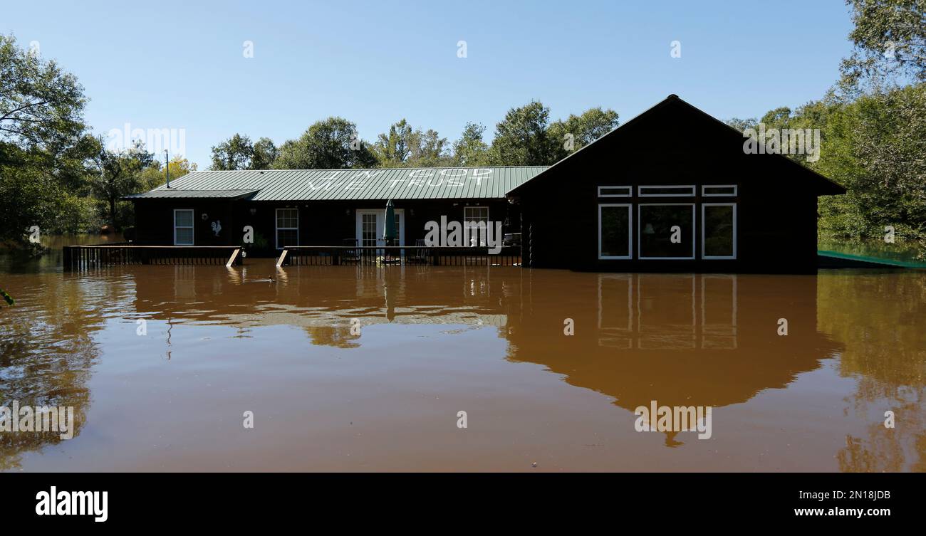 The home of Lisa and Jody Britton's is surrounded by floodwater in ...