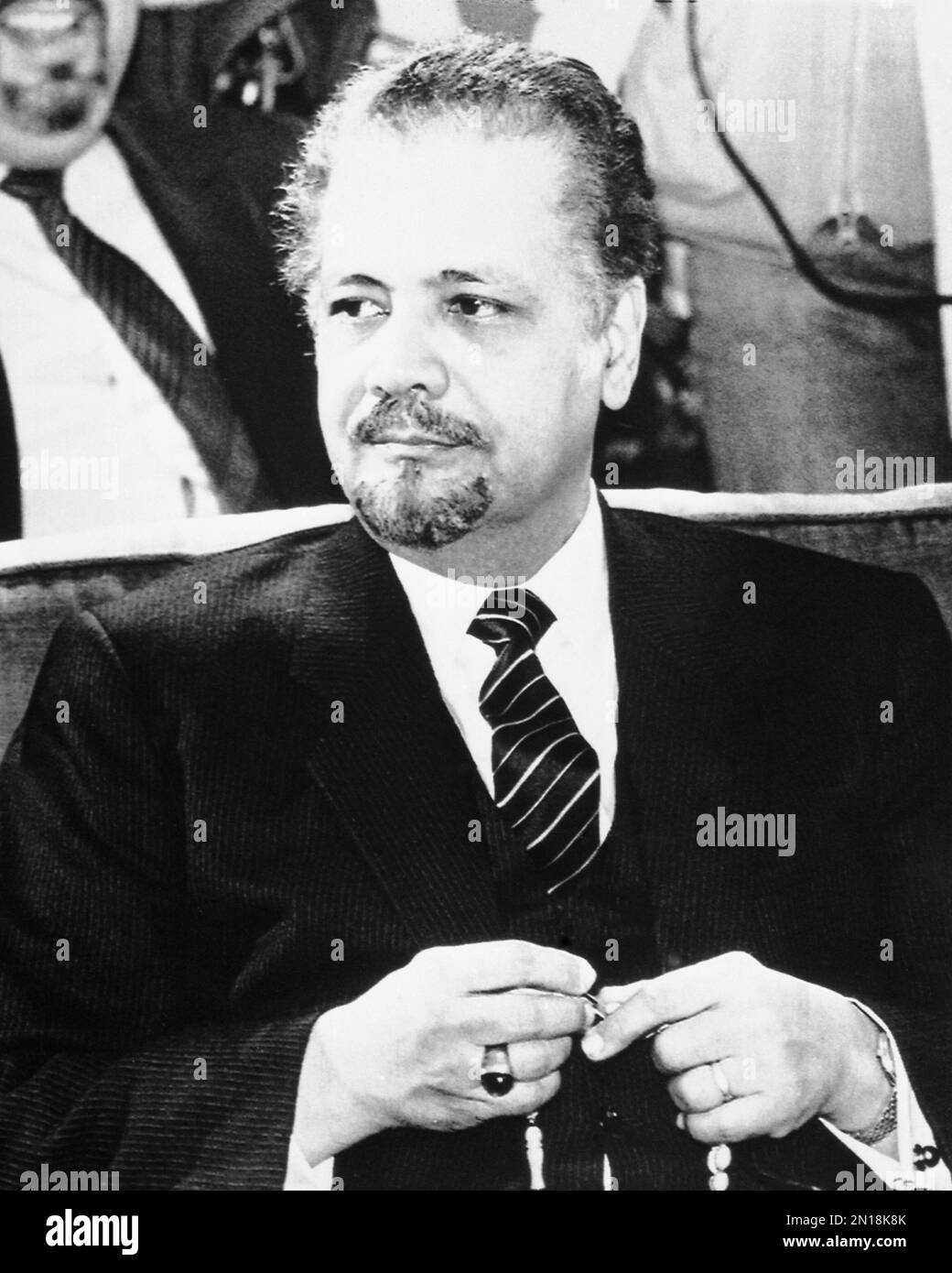 Sheikh Ahmed Zaki Yamani, oil minister of Saudi Arabia sits around ...