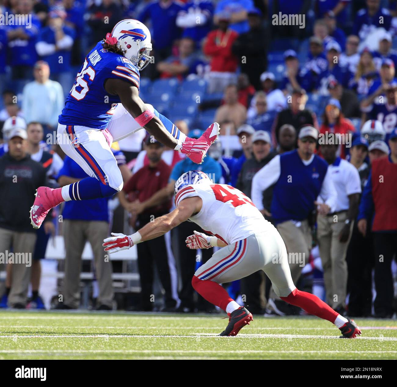 Buffalo Bills running back Anthony Dixon, top, leaps over New York ...