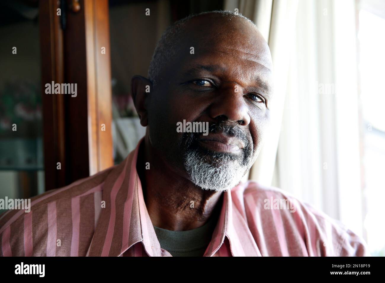 Kenneth Evans poses for a photograph in his home Wednesday, Sept. 16 ...