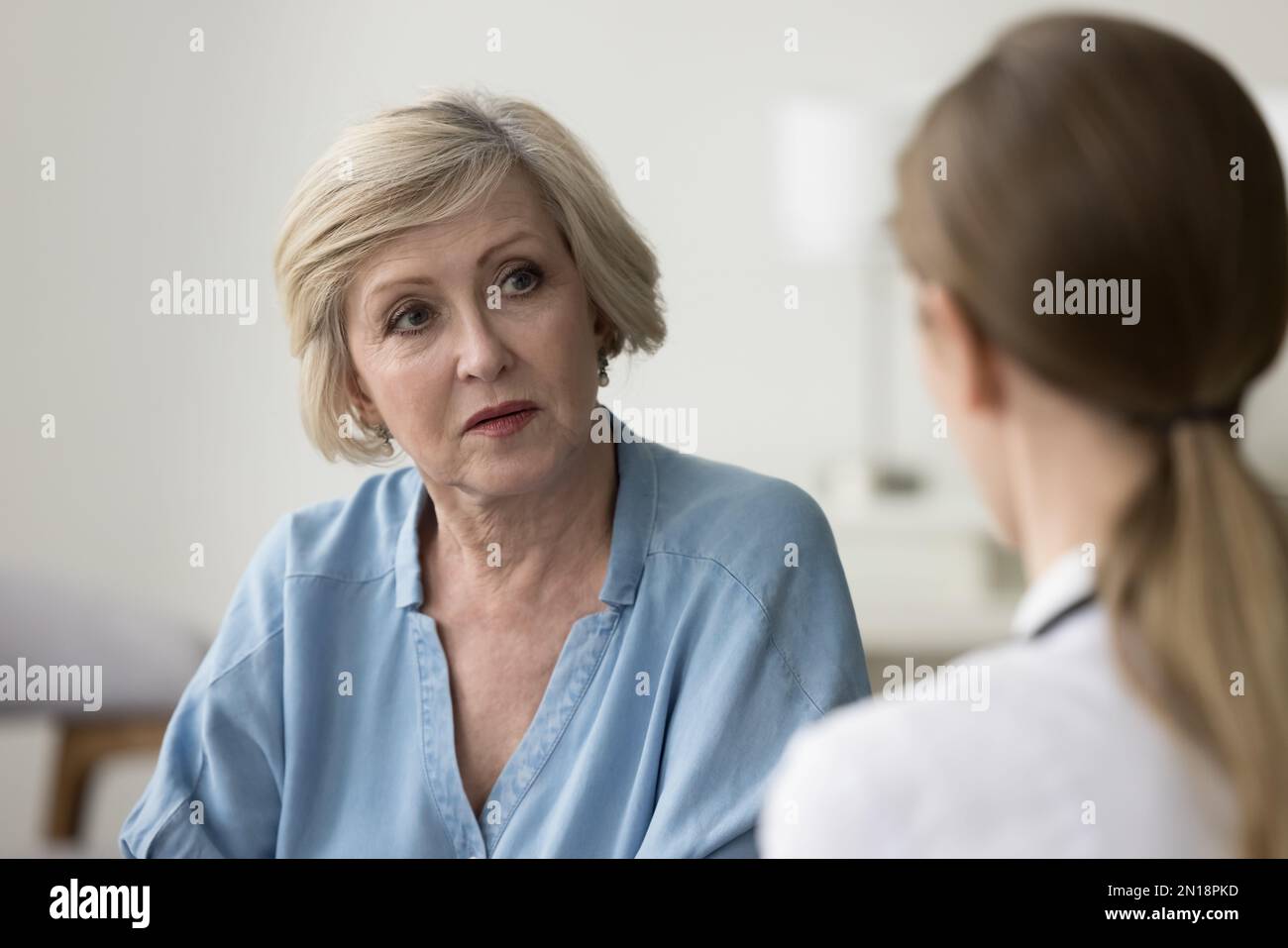 Serious older patient woman visiting doctor, getting geriatric health problems Stock Photo - Alamy