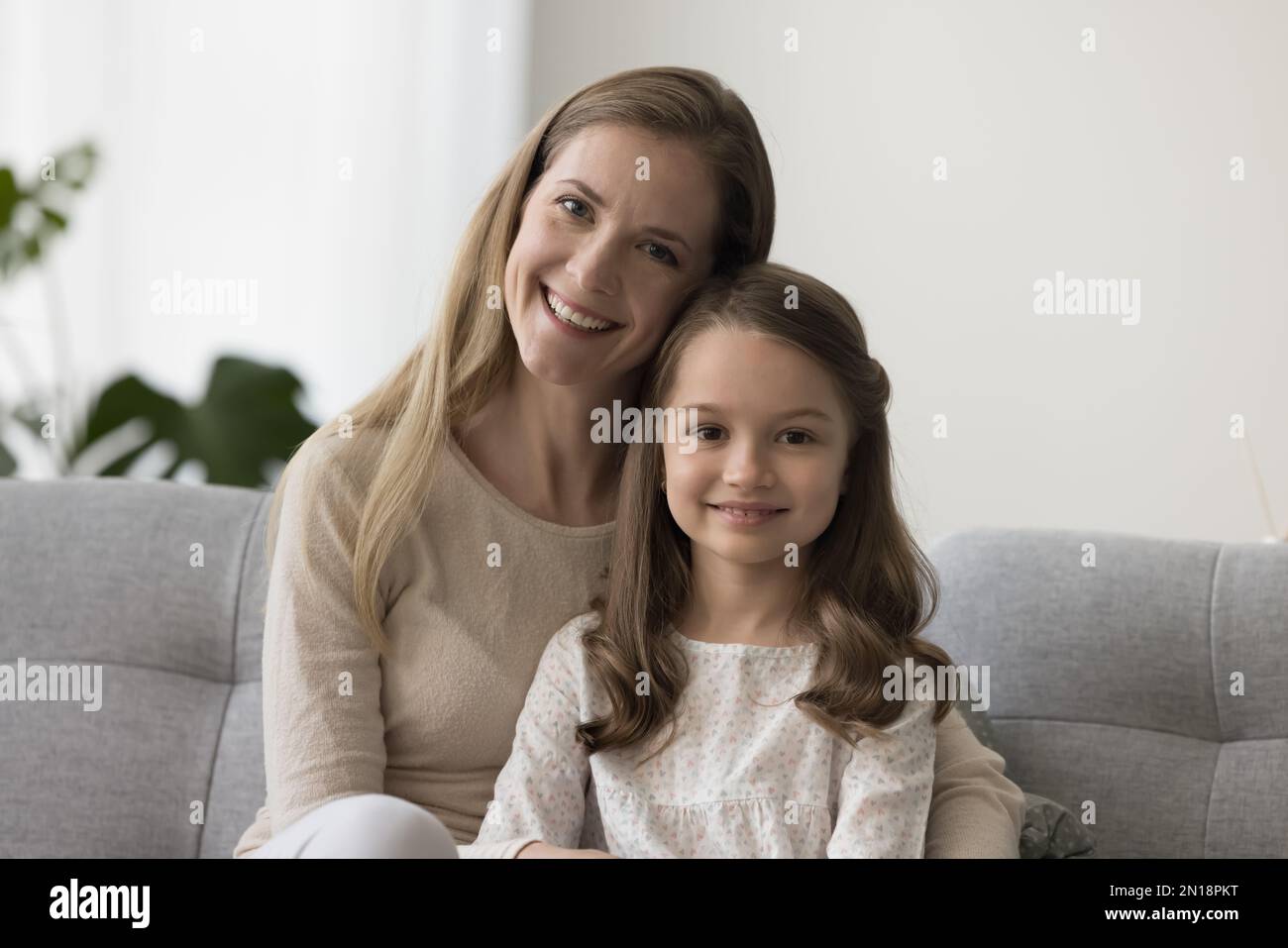 Cheerful happy mother and cute pretty daughter kid home portrait Stock ...