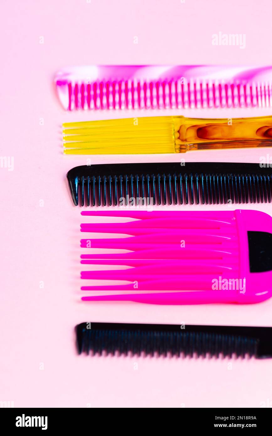 Close up of colored professional salon barber hair combs. Vertical shot ...
