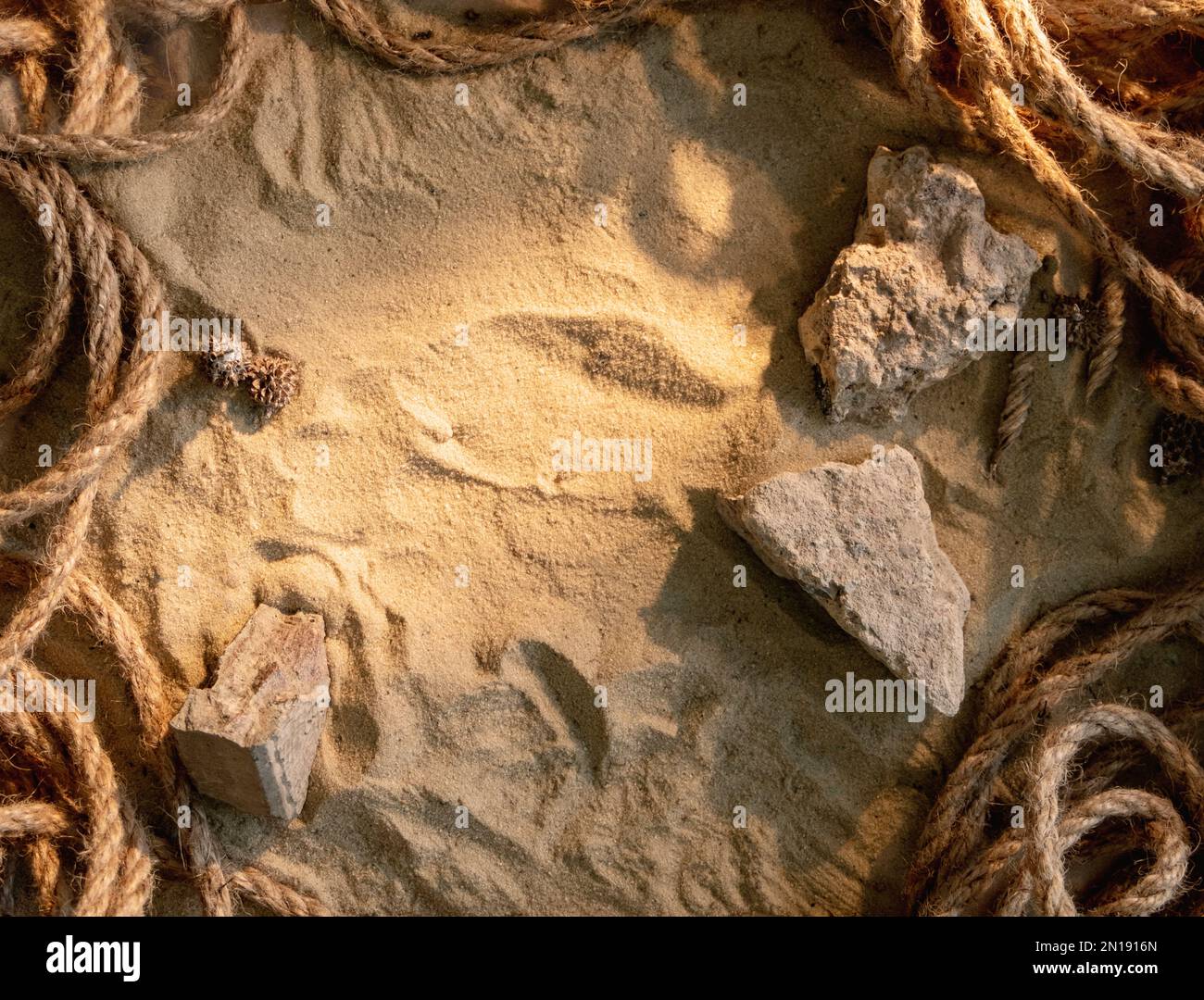 nautical composition marine frame stone rope sand Stock Photo - Alamy