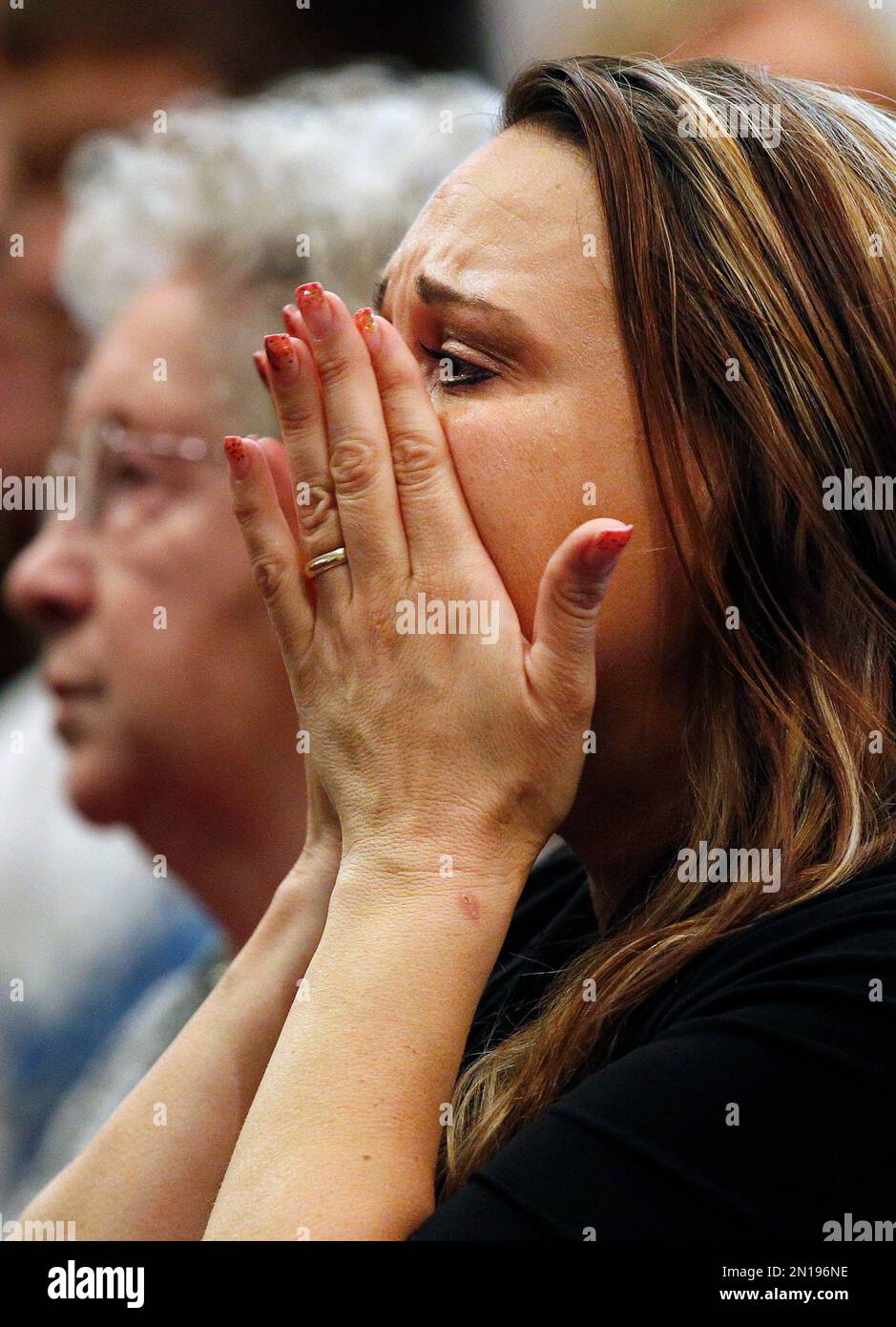 Sarah Mosley cries during a church service at the New Beginnings Church ...
