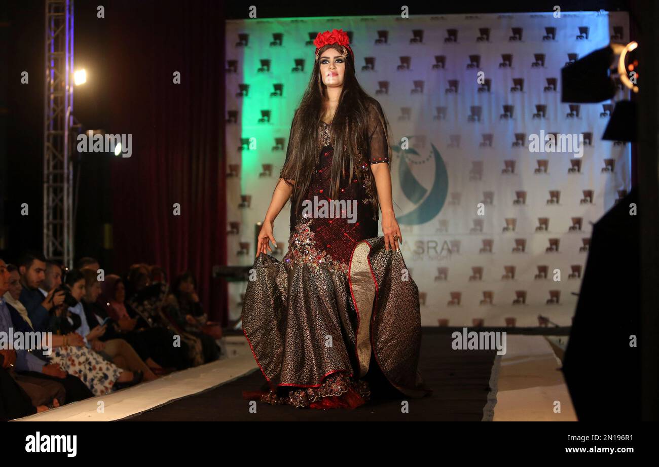 A model wears a dress designed by Iraqi designer Ziad Tariq during a ...