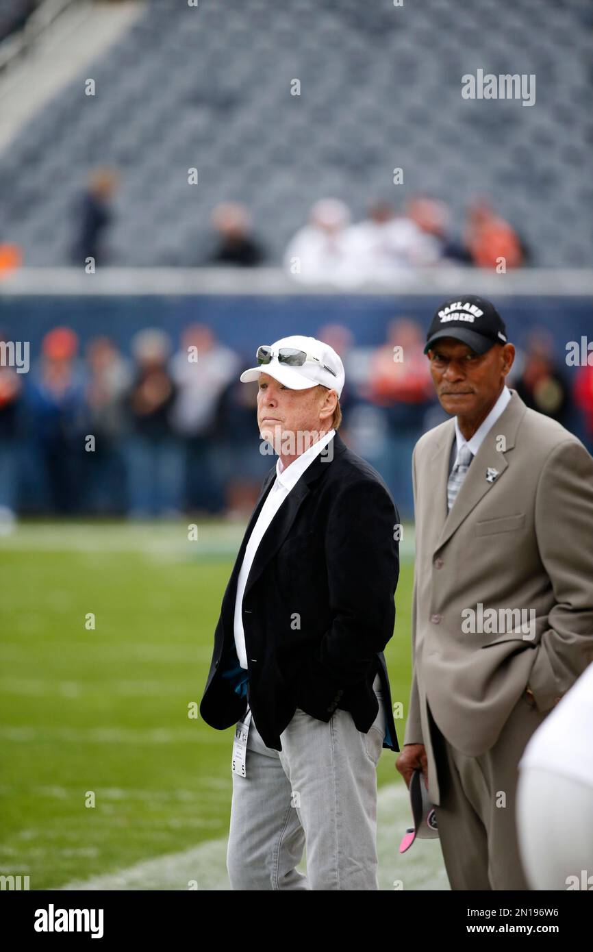 Oakland Raiders owner Mark David walks around the sideline with former ...