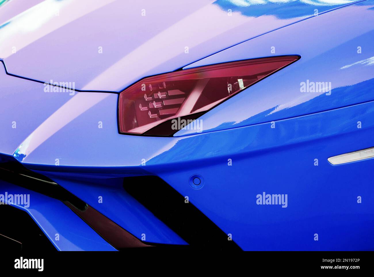 headlight of a luxury sports car. blue expensive automobile Stock Photo ...