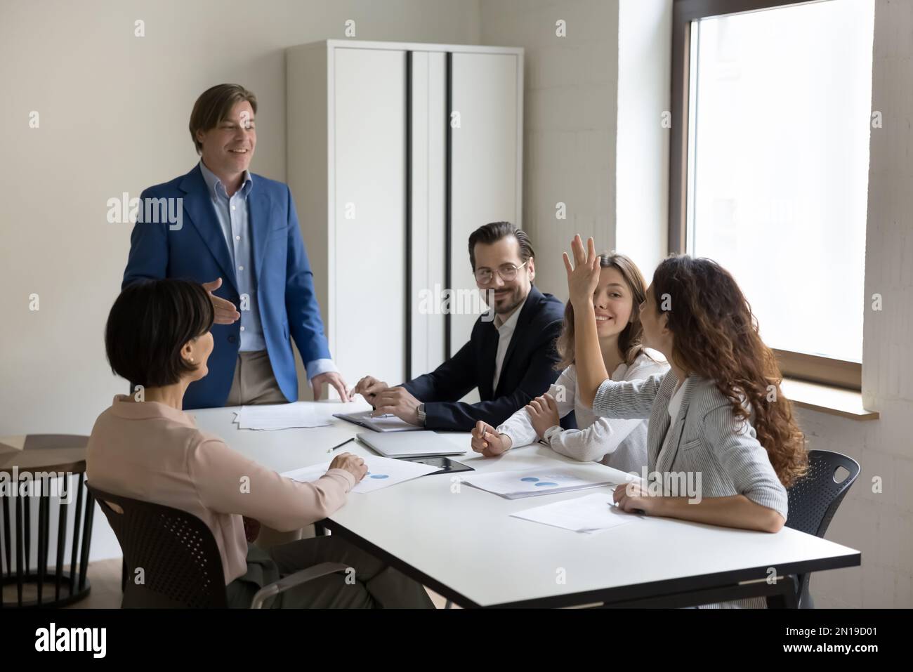 Positive business trainer man giving workshop, training employees Stock ...