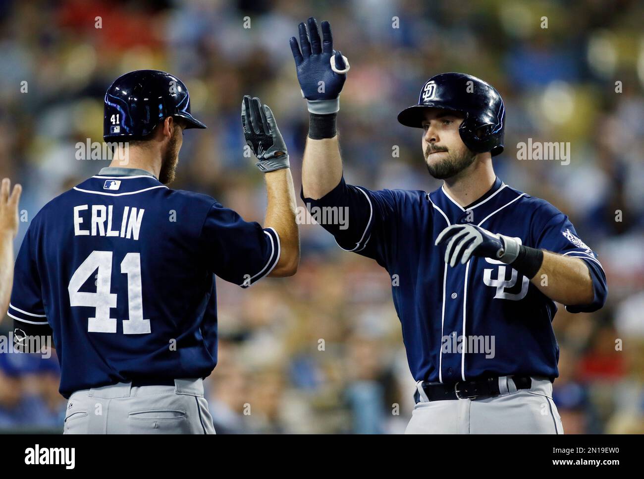 San Diego Padres' Austin Hedges, right, celebrates his solo home run ...