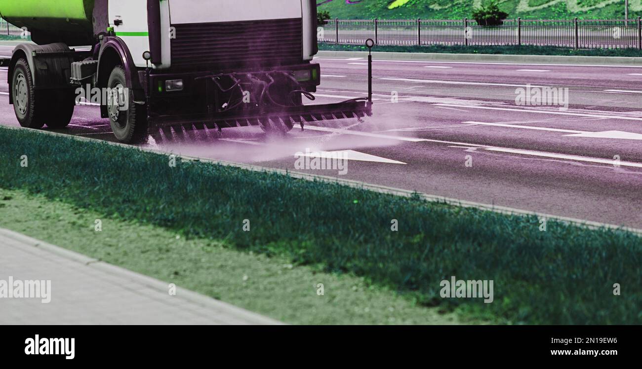 Cleaning machine washes asphalt road surface the city street Stock ...