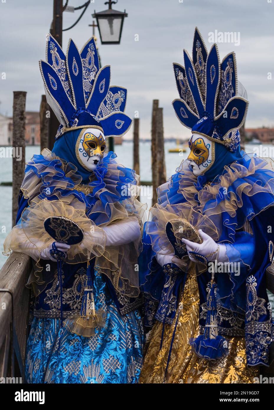 People wearing elaborate and colorful masks during the Venice Carnival ...