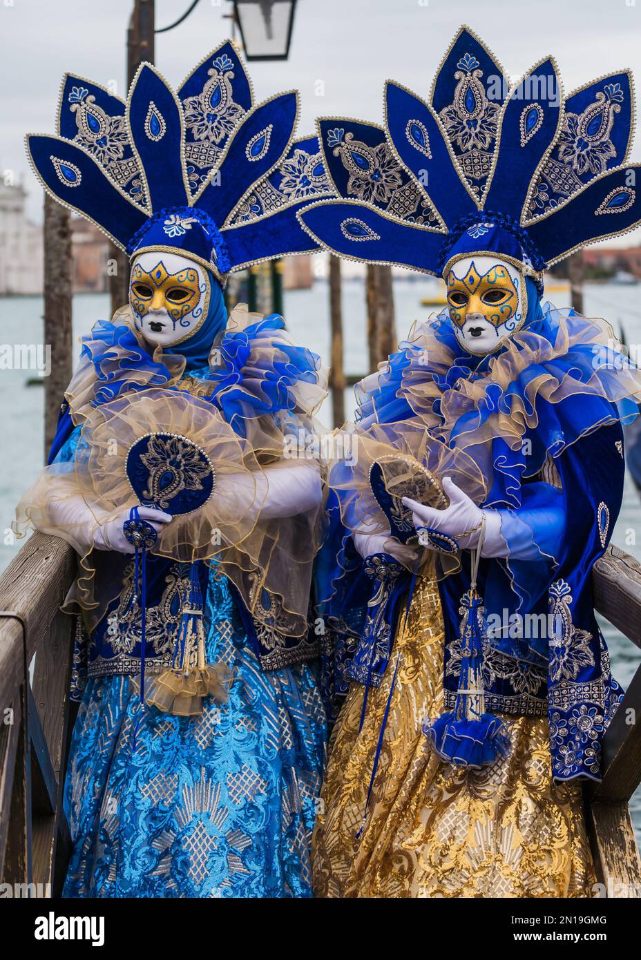 People wearing elaborate and colorful masks during the Venice Carnival ...