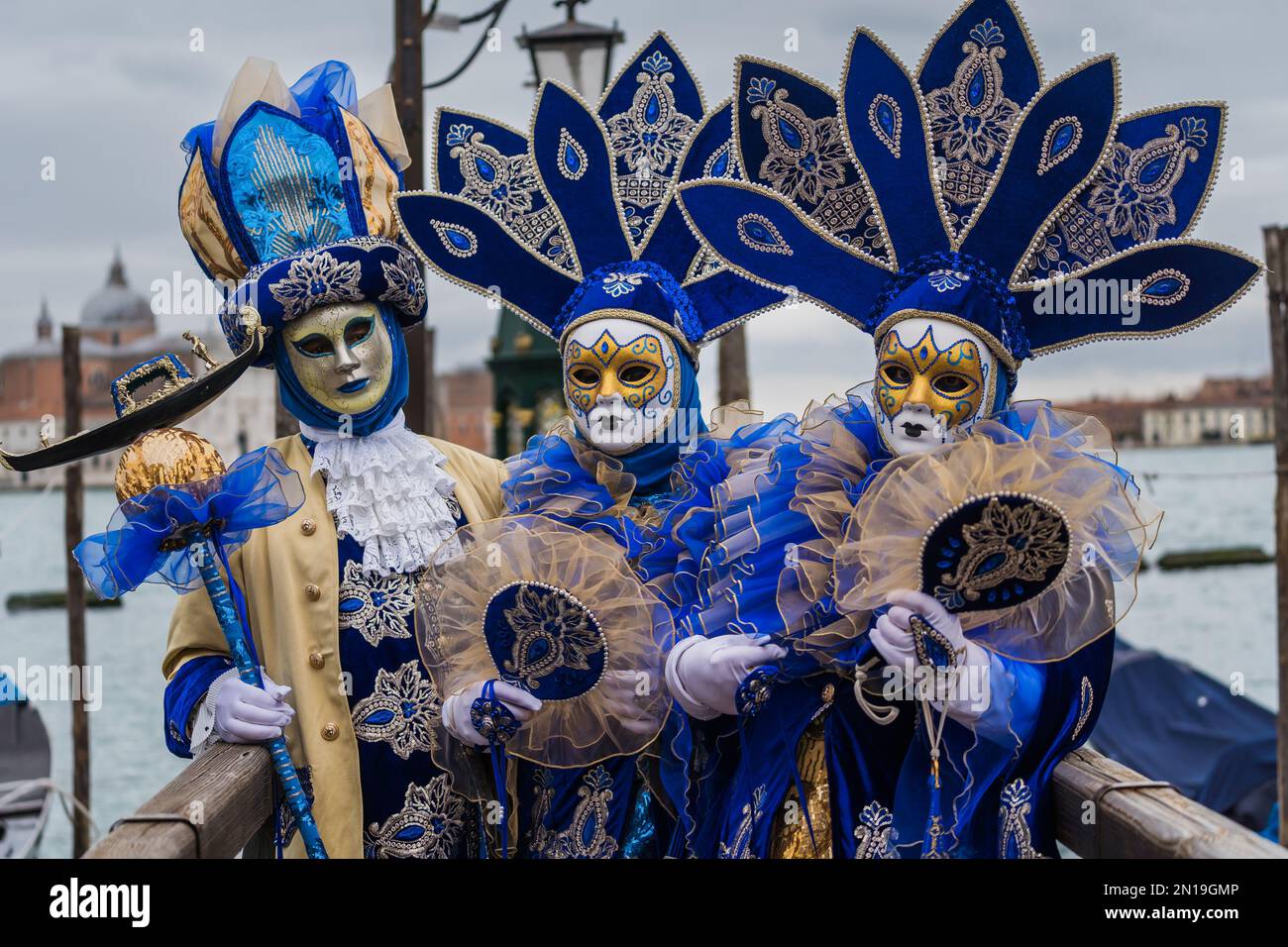 People wearing elaborate and colorful masks during the Venice Carnival ...