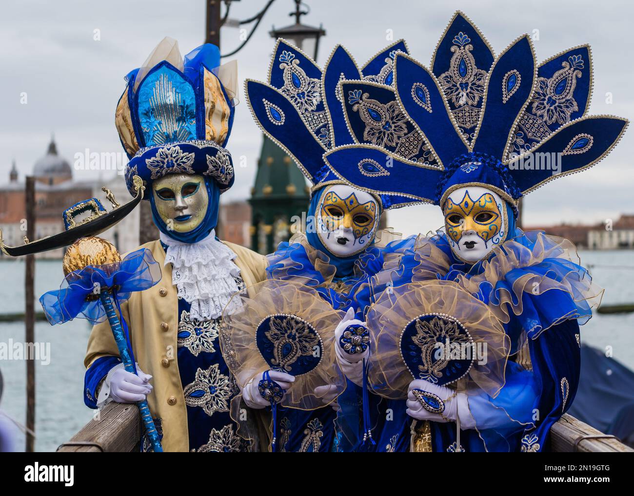 People wearing elaborate and colorful masks during the Venice Carnival ...