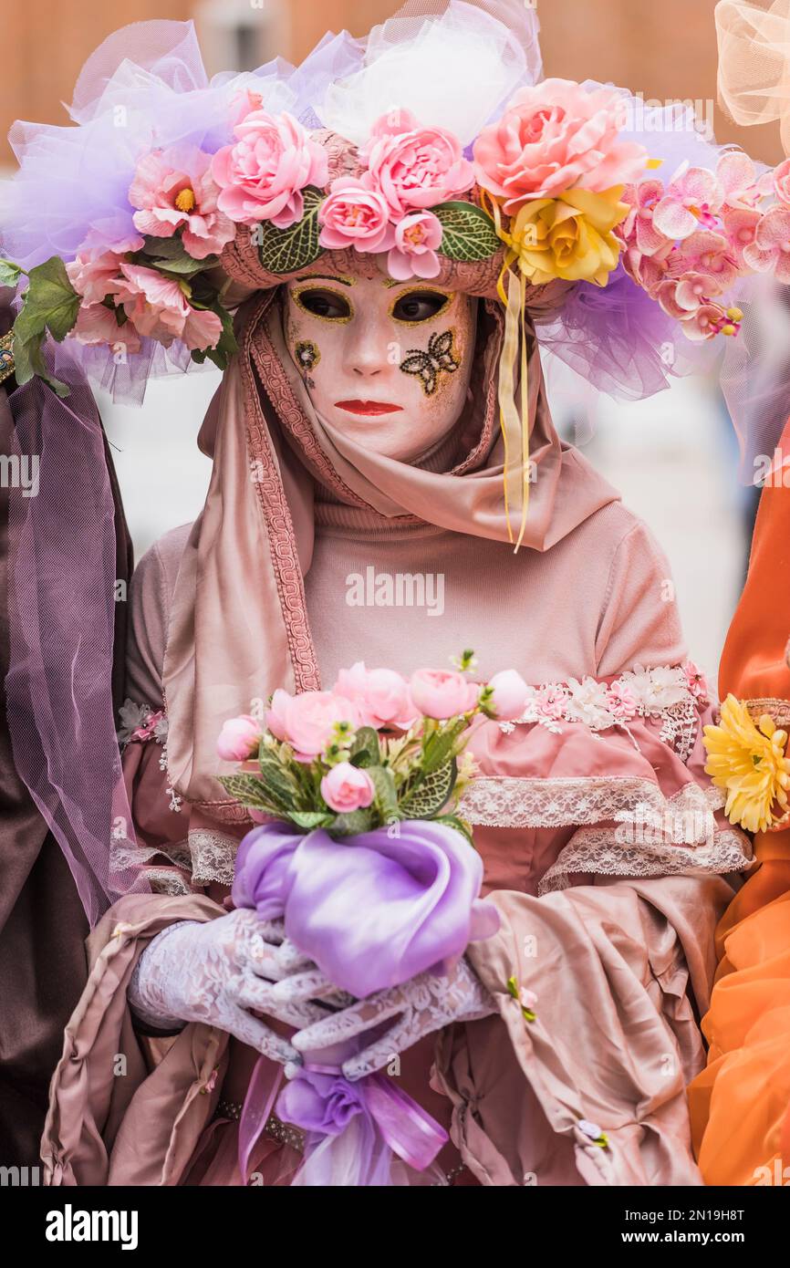 People wearing elaborate and colorful masks during the Venice Carnival ...