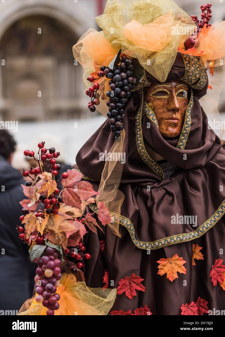 People wearing elaborate and colorful masks during the Venice Carnival ...