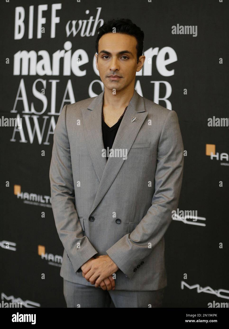 Indian director Mozez Singh poses as he arrives to attend Asia Star ...