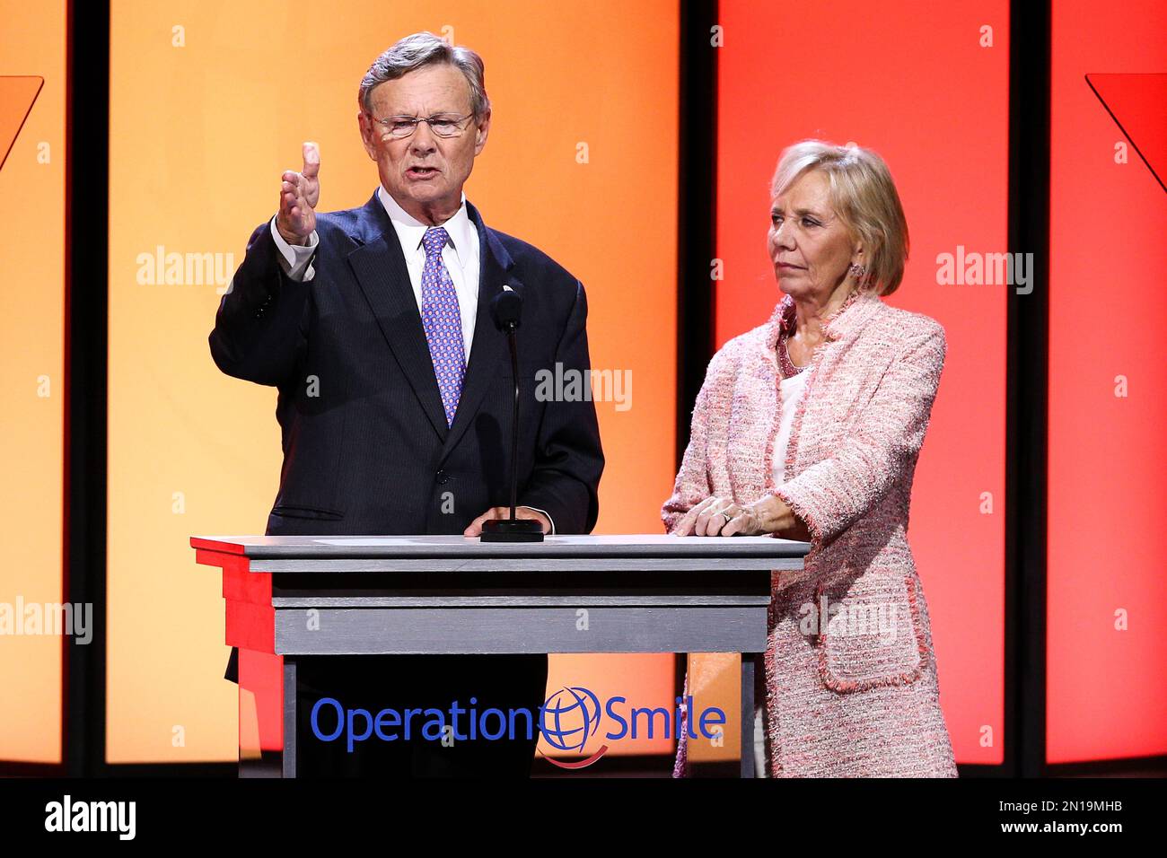 Dr. Bill Magee, left, and Kathy Magee speak on stage at the 2015 ...