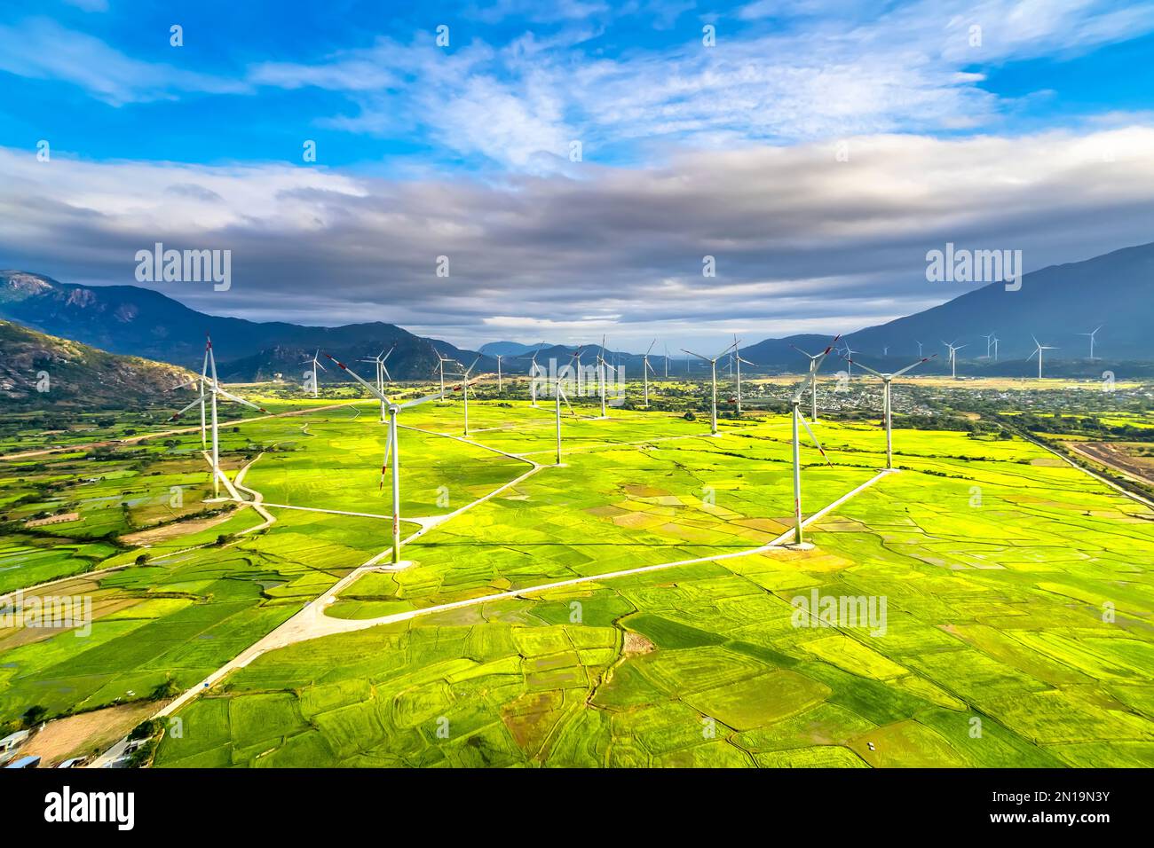 Panoramic view of wind farm or wind park. Green meadow with Wind ...