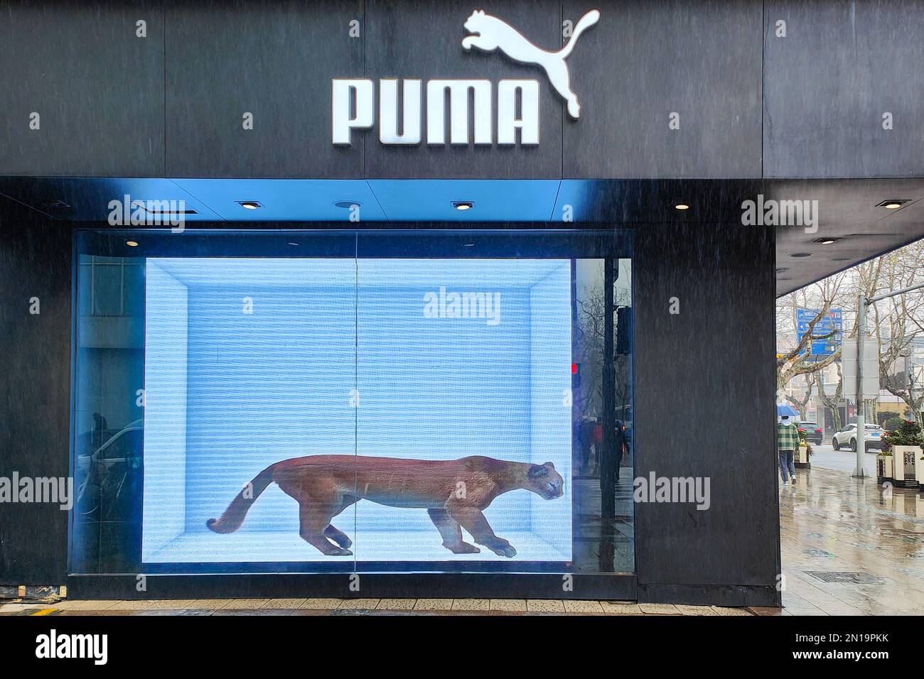 SHANGHAI, CHINA - FEBRUARY 6, 2023 - Citizens walk past PUMA clothing ...