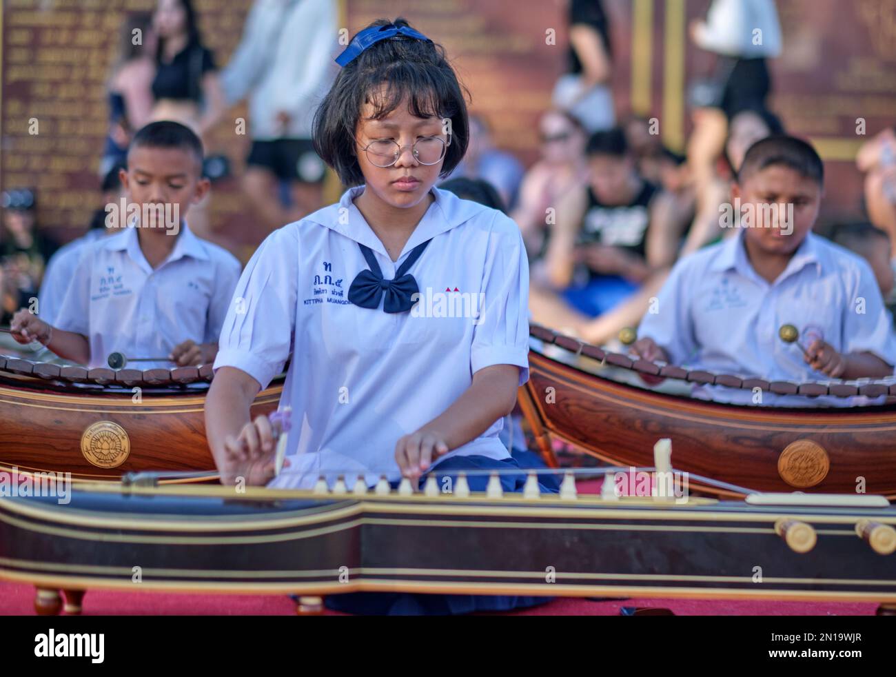 Thai school children during an opren-air performance of traditional ...