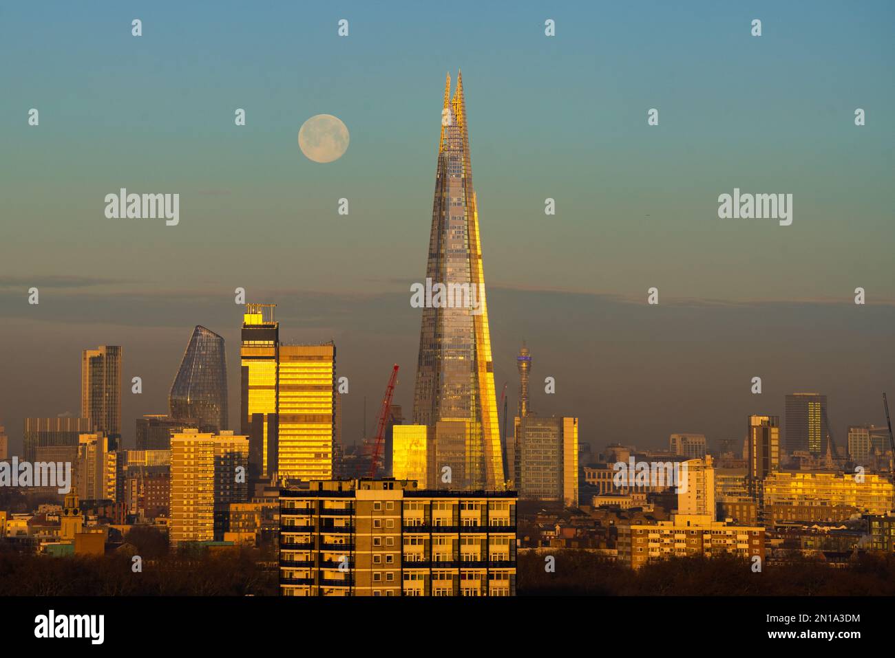 London, UK. 6th February 2023. UK Weather: Full Moonset over The Shard ...