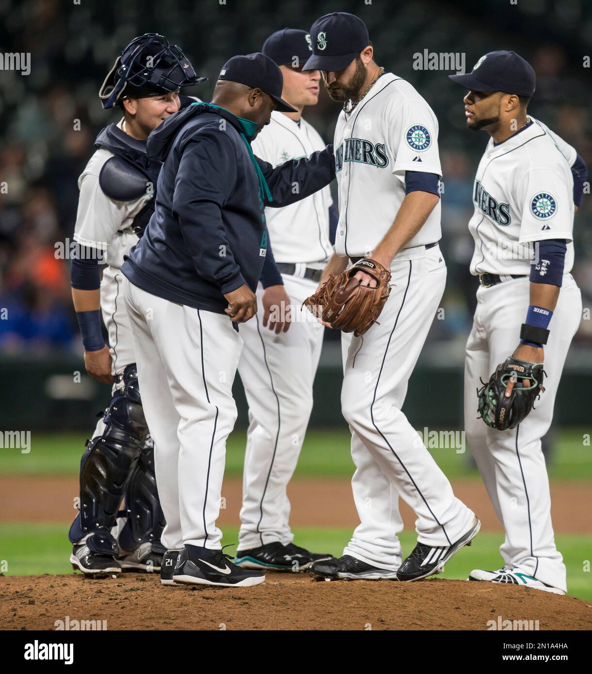 Seattle Mariners manager Lloyd McClendon, second from left, replaces ...