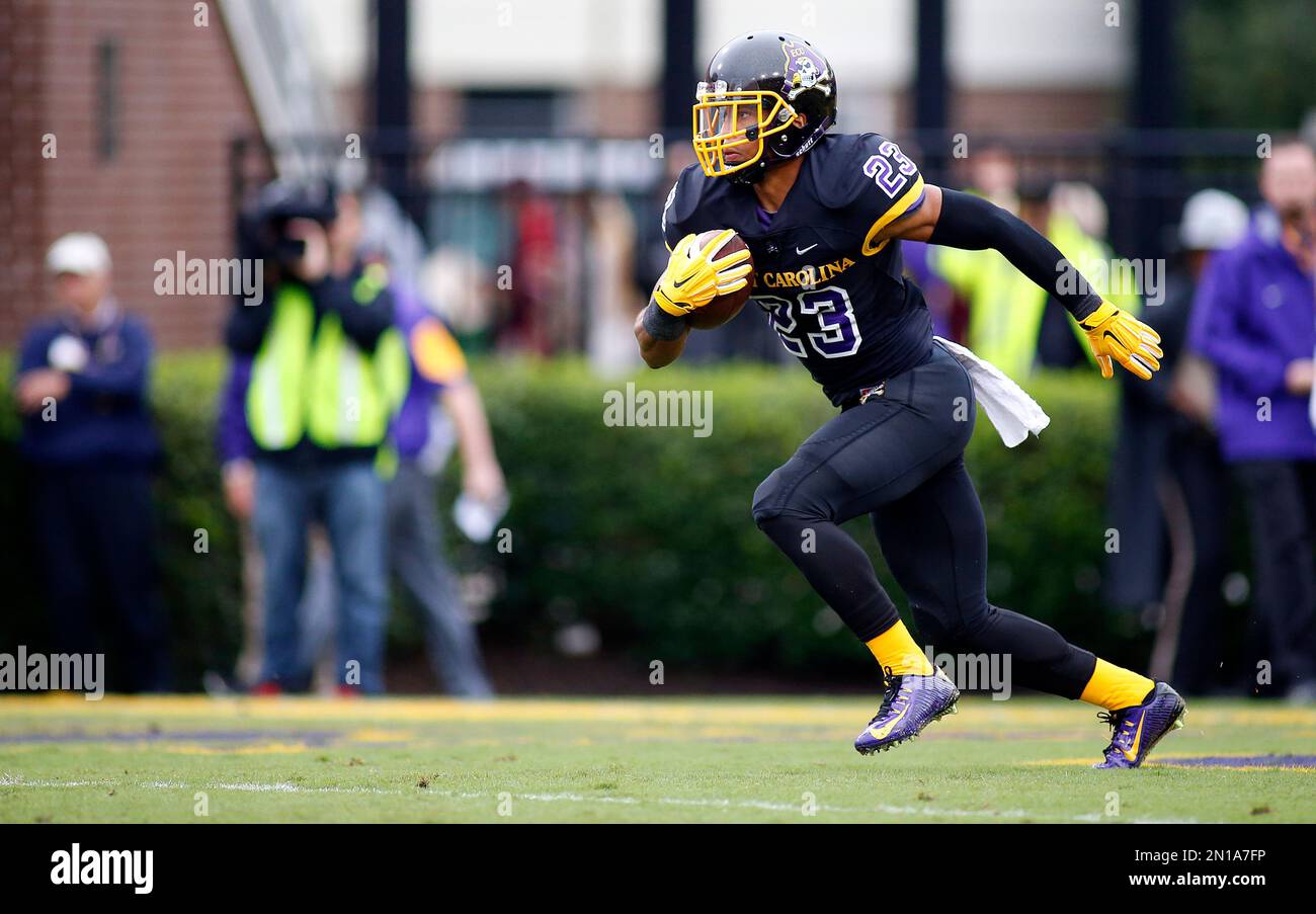 East Carolina 's Quay Johnson (23) runs the ball during the first half ...