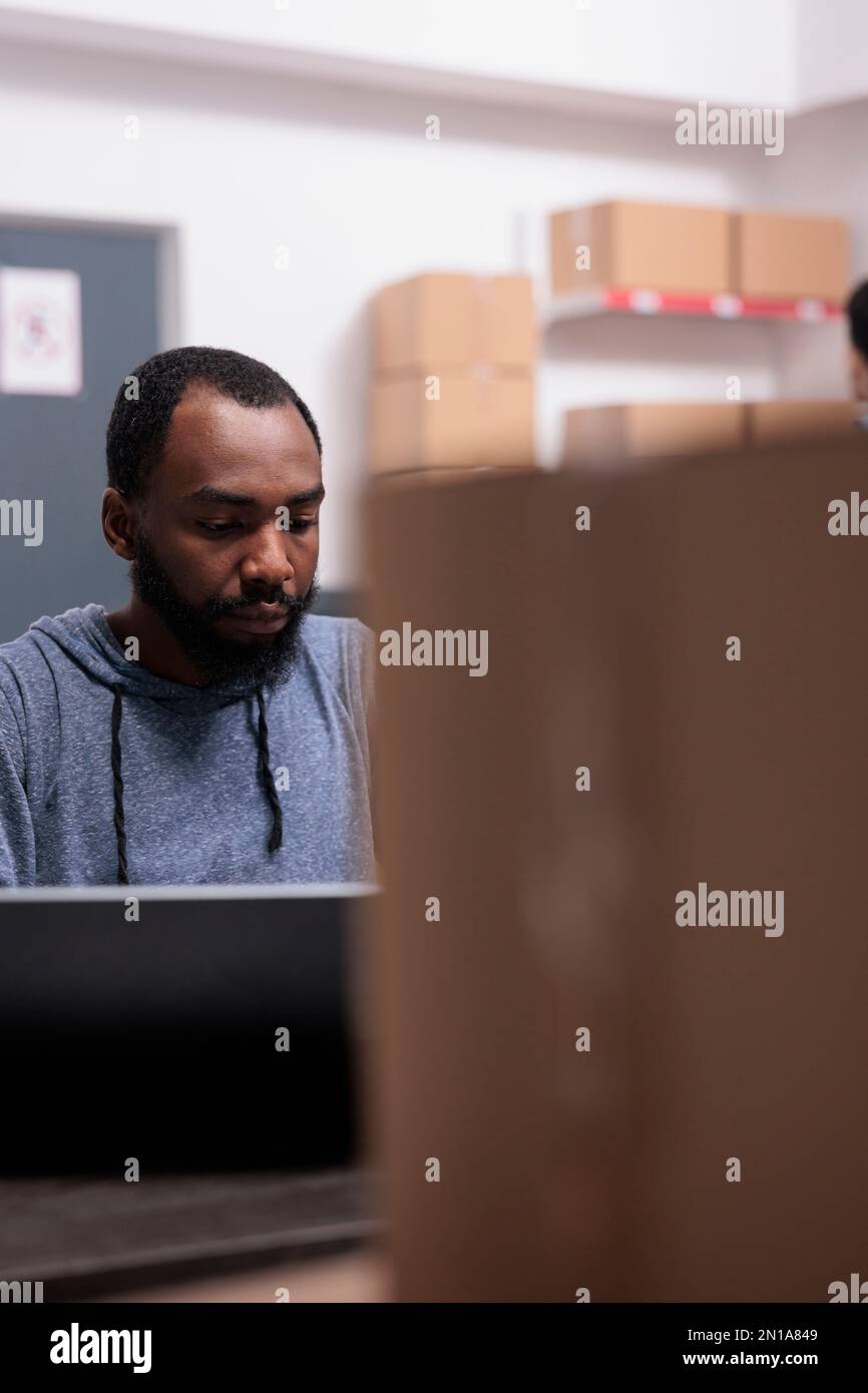 Factory worker putting packages boxes hi-res stock photography and ...