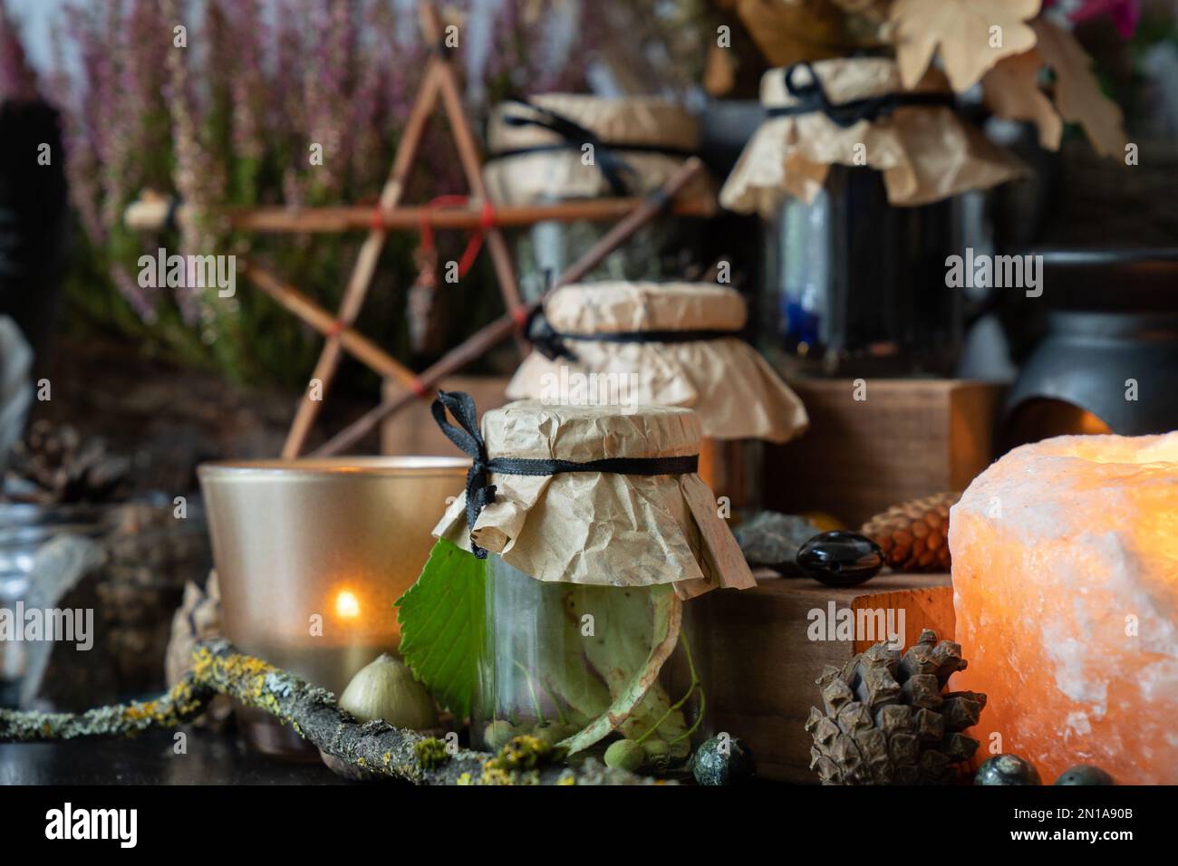 Potions in glass jars. Magic items scene Stock Photo - Alamy