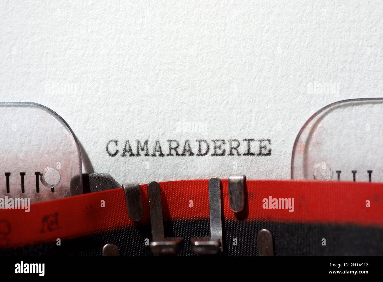 Camaraderie word written with a typewriter Stock Photo - Alamy