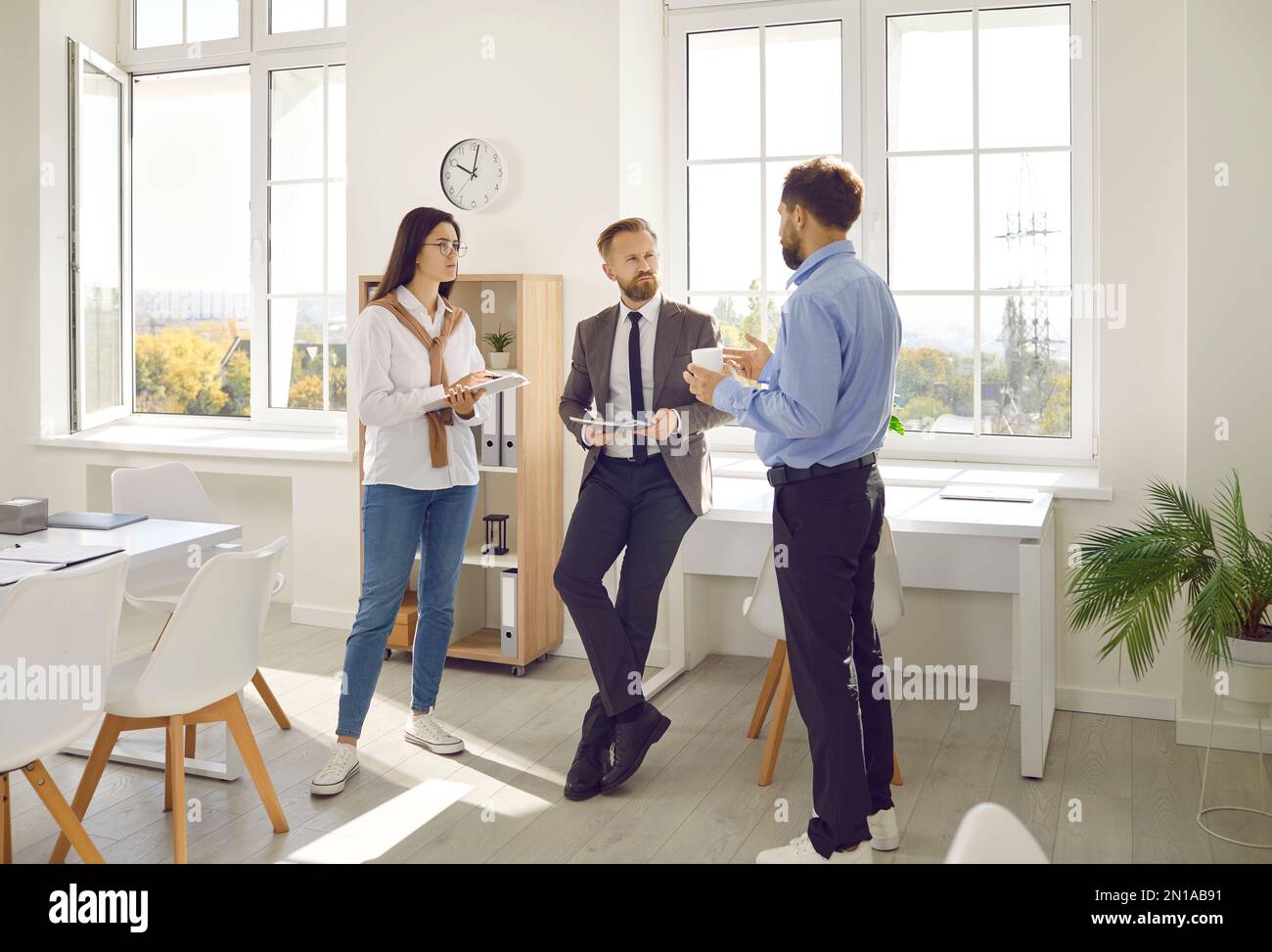 Confident businessman explaining strategy, advising colleagues during ...