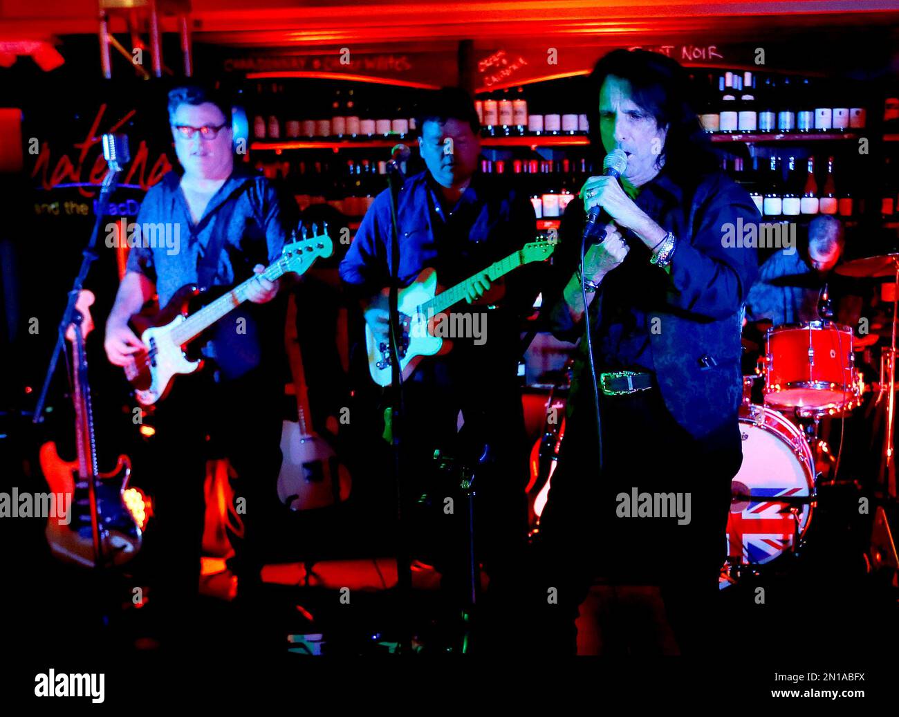 Singer Alice Cooper, right, performs with Phoenix-based band the Saucy ...