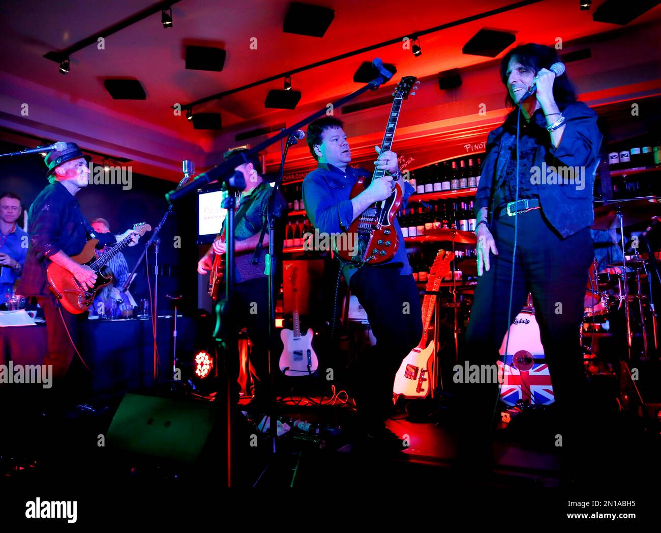 Singer Alice Cooper, right, performs with E Street Band member Nils ...