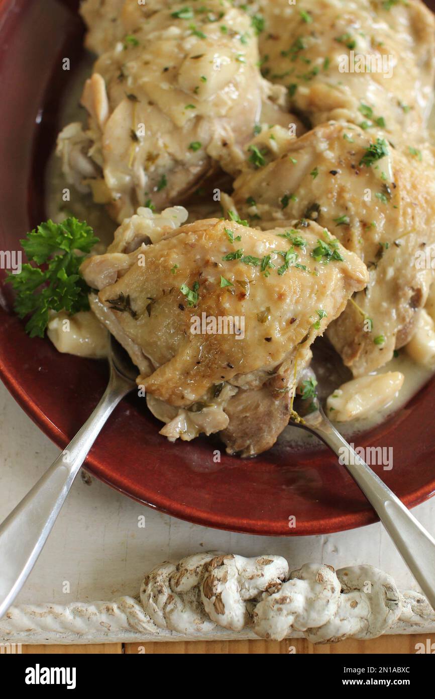 This Sept. 14, 2015 photo shows chicken with Champagne and 40 cloves of ...