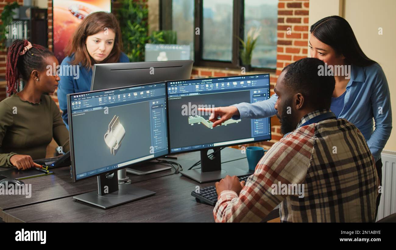 Creative 3d engineers designing mechanical clamp on manufacturing cad ...