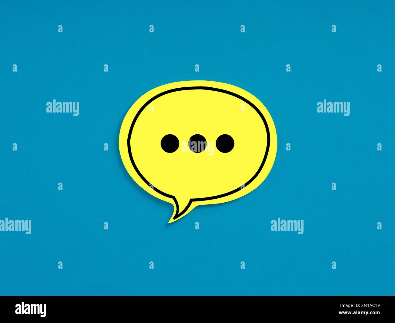 Three dots on yellow speech bubble on blue background. Discussion ...