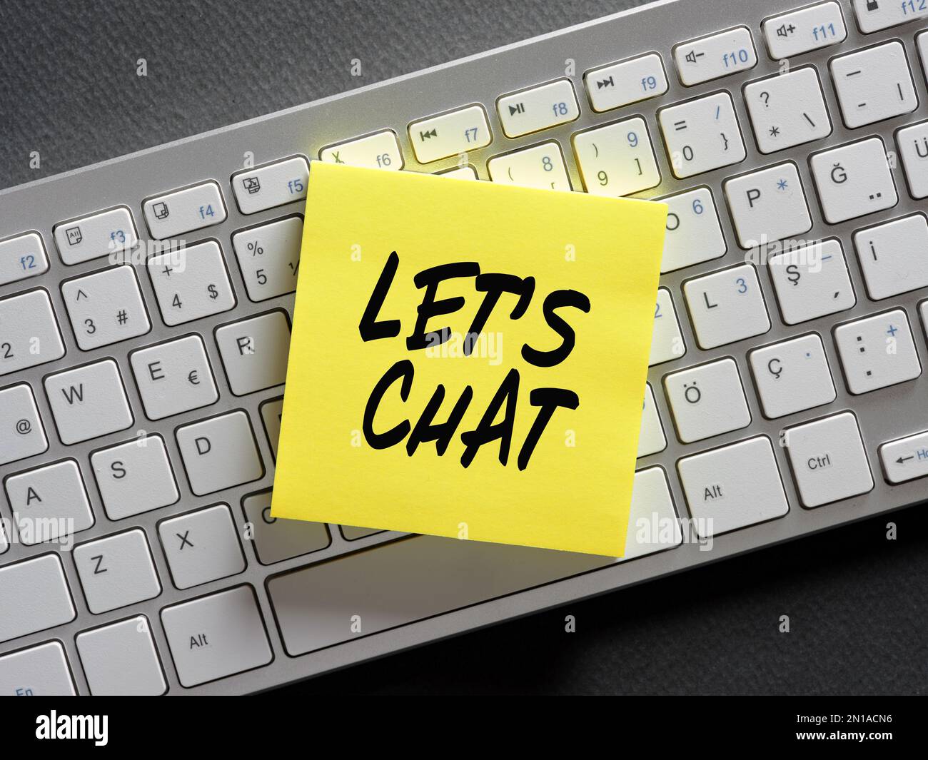 Online computer chatting concept. The word let's chat written on a ...